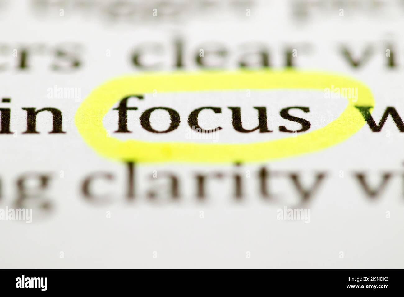 Close up of the typed word focus circled in yellow fluorescent ...