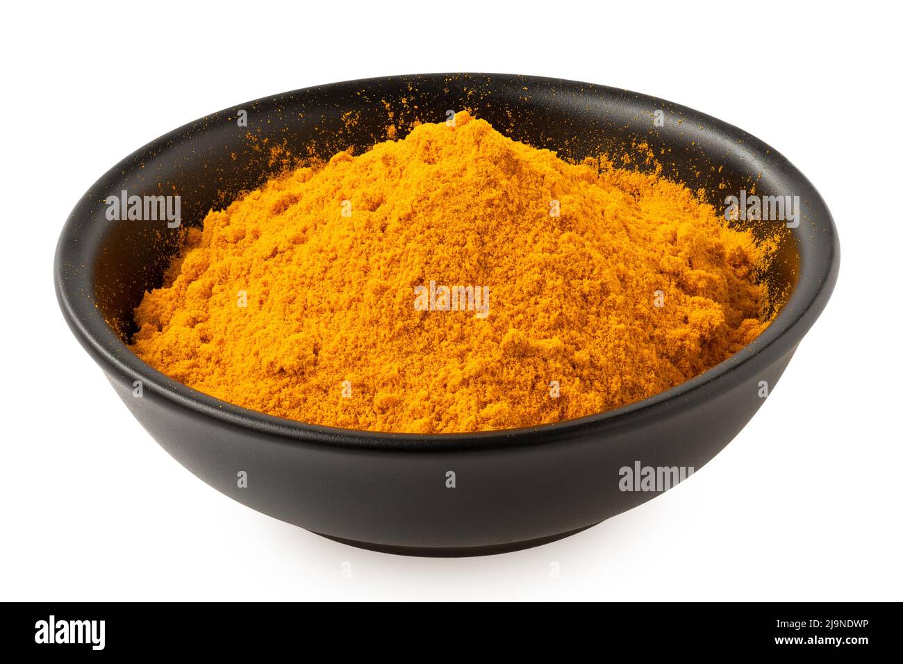 Turmeric powder in black Cut Out Stock Images & Pictures - Alamy