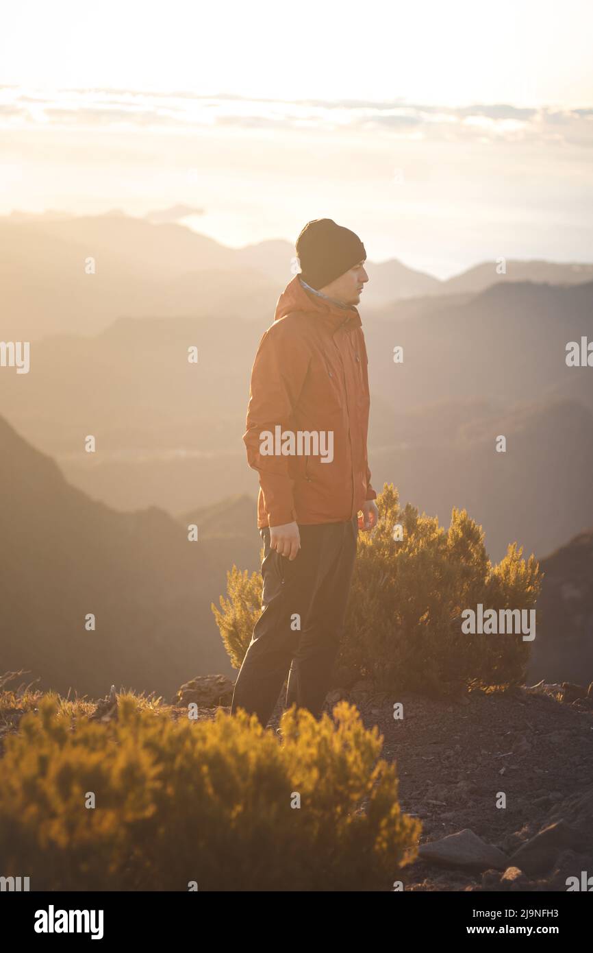 Traveller with a smile on his face enjoys the view from Pico Ruivo, the ...