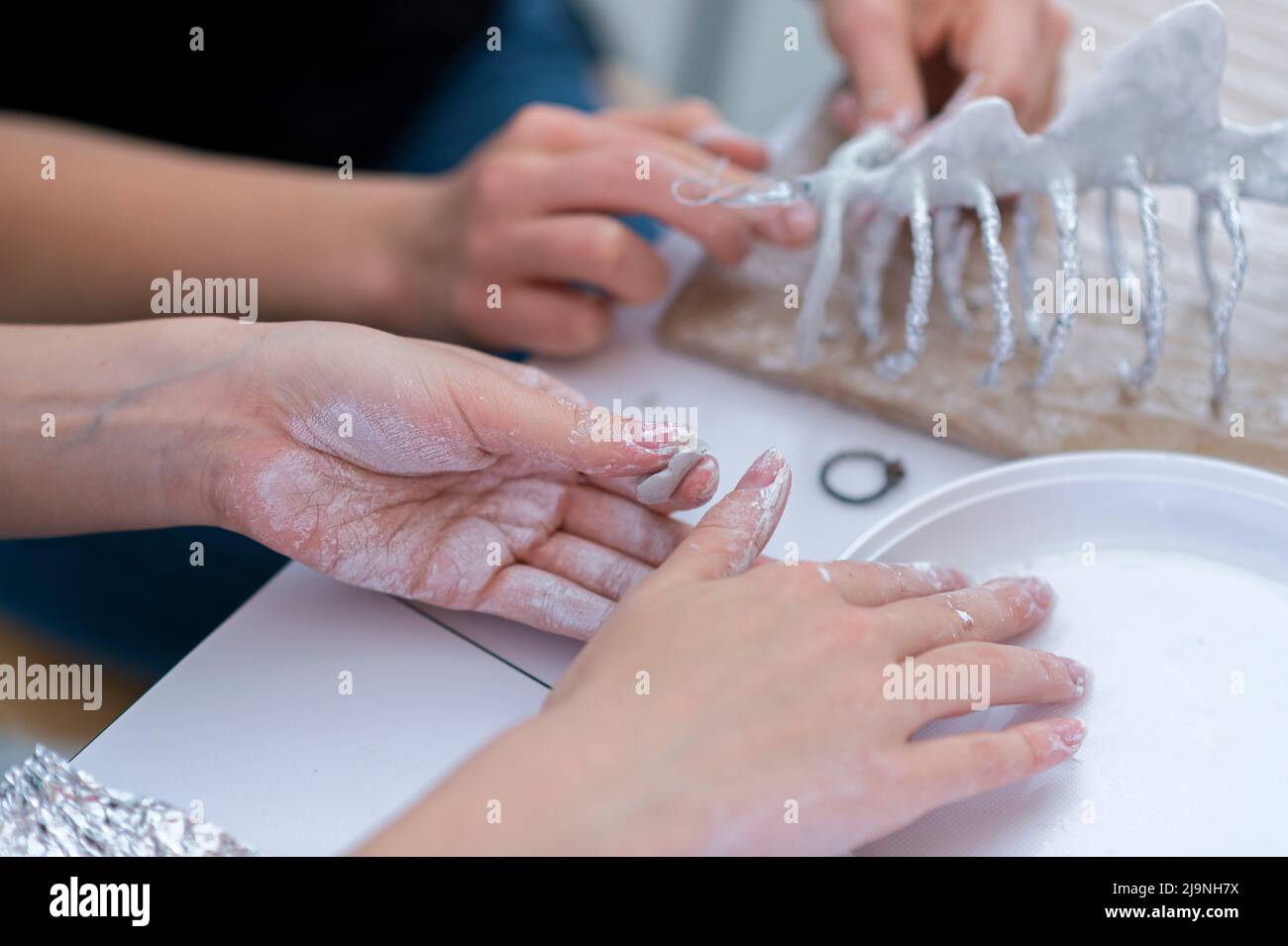 Woman molding and sculpting clay art pieces. Horizontal creative theme ...