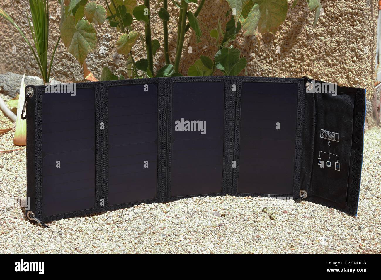 A portable solar panel on the ground. Ecological object used to ...