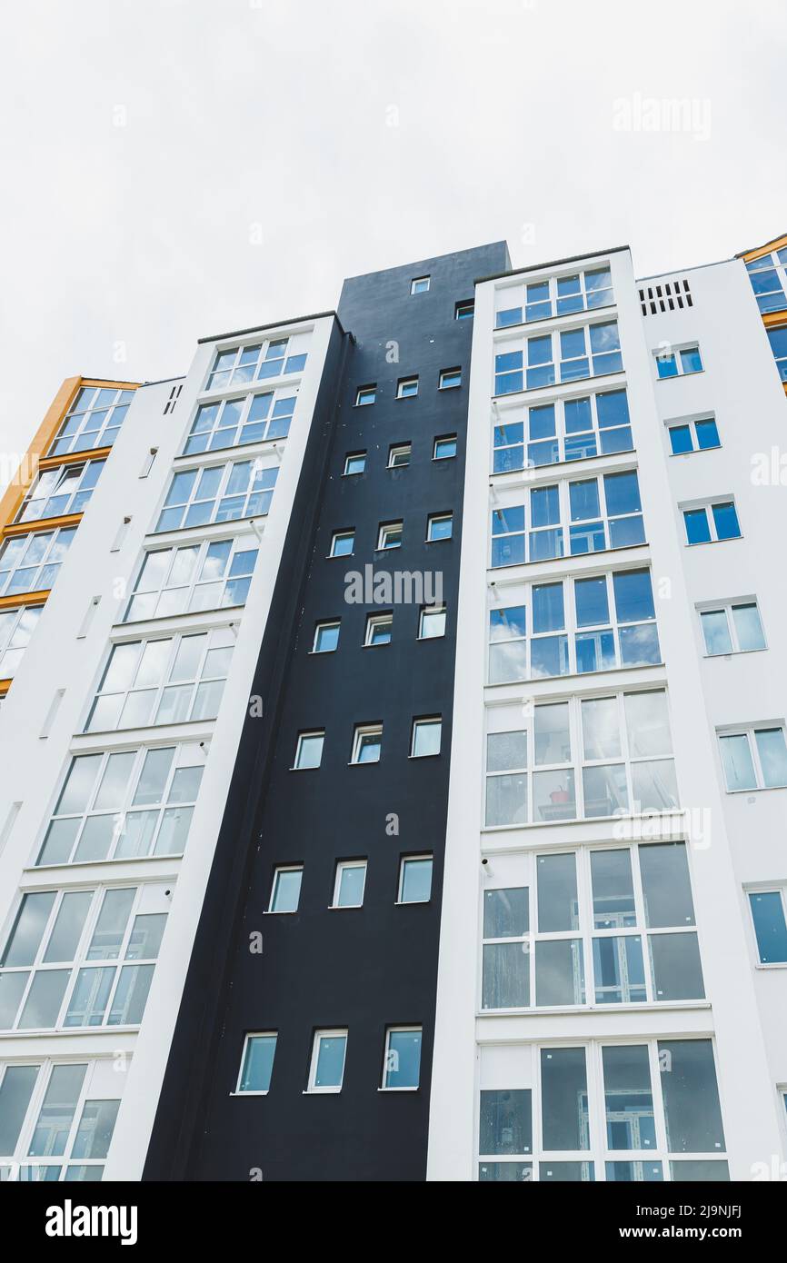 New modern multi-storey residential building. Plastic windows in a new apartment. Apartment with ...
