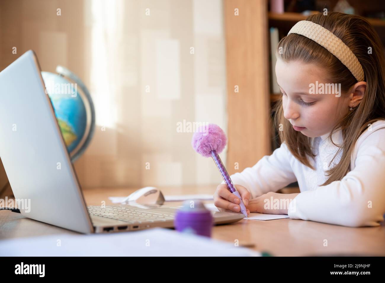 Online remote learning. High school kids with computer having video conference chat with teacher ...