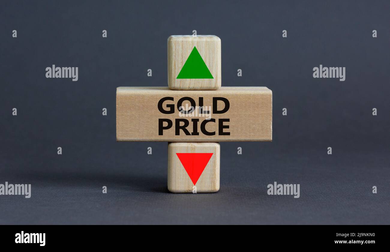 Gold price symbol. A wooden cube with arrow symbolizing that Gold price ...