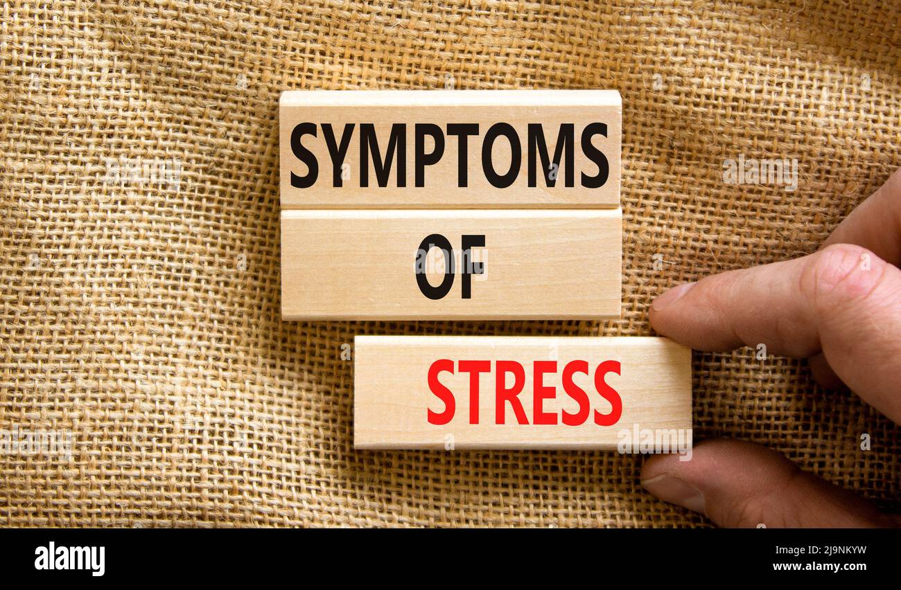Symptoms of stress symbol. Concept words Symptoms of stress on wooden ...