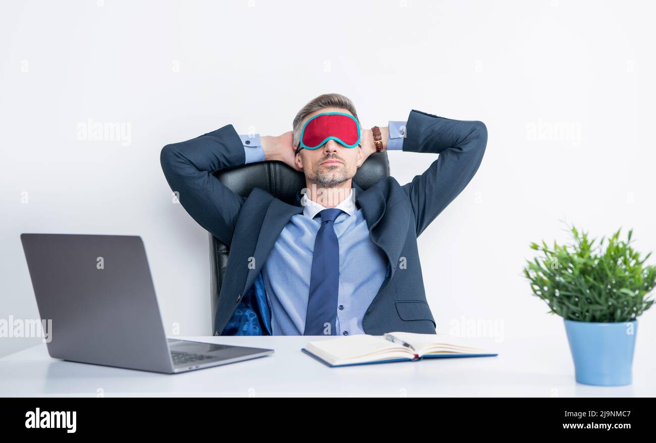 tired boss relax in sleep mask at workplace Stock Photo - Alamy