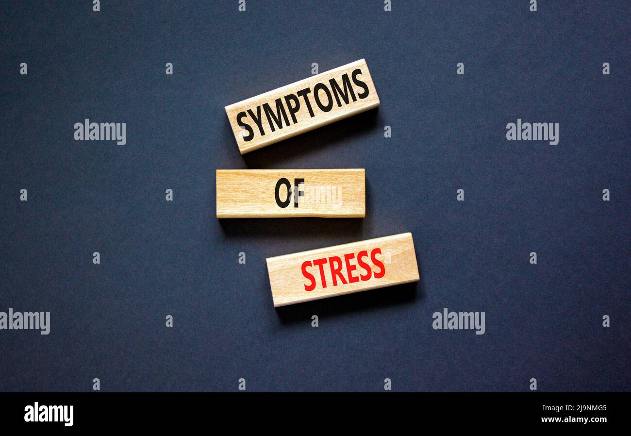 Symptoms of stress symbol. Concept words Symptoms of stress on wooden ...