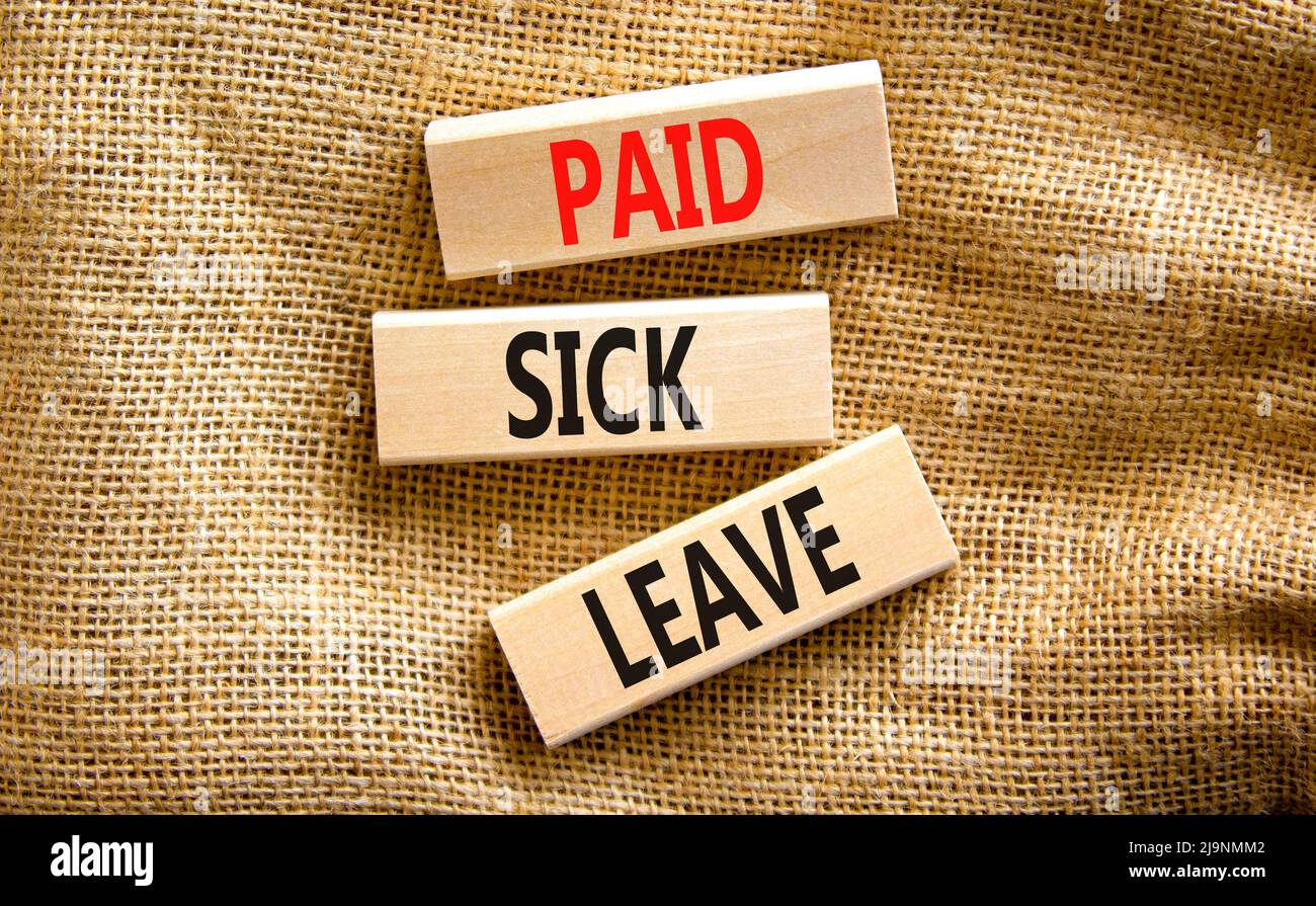 Paid sick leave symbol. Concept words Paid sick leave on wooden blocks ...