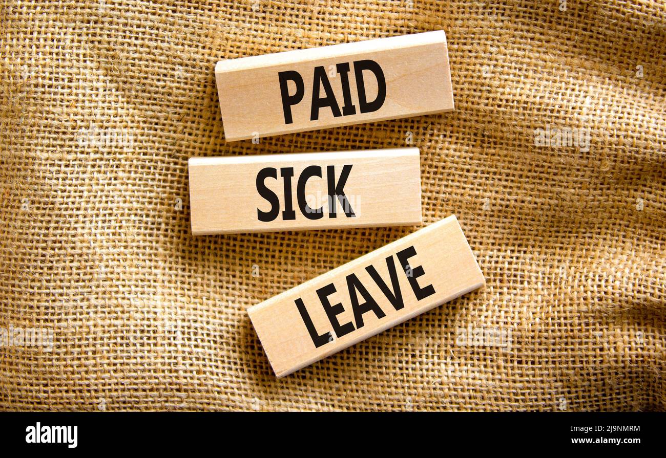 Paid sick leave symbol. Concept words Paid sick leave on wooden blocks ...