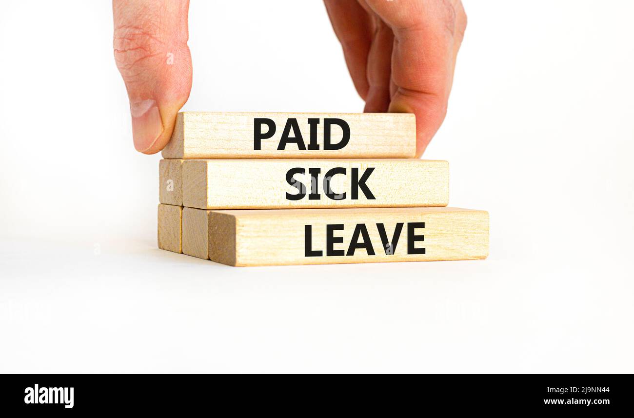Paid sick leave symbol. Concept words Paid sick leave on wooden blocks ... Paid sick leave symbol. Concept words Paid sick leave on wooden blocks ...