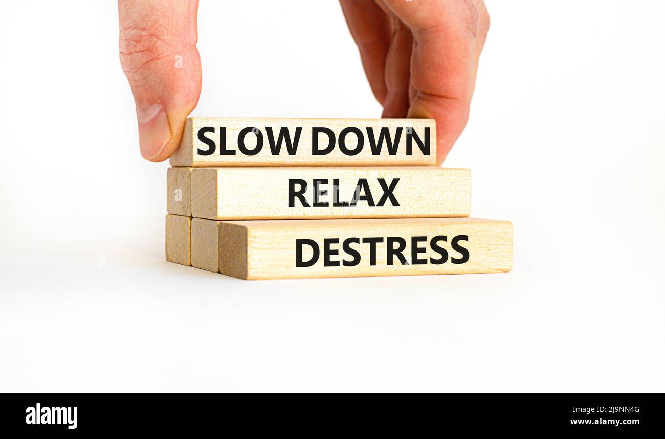 Destress symbol. Concept words Slow down Relax Destress on wooden ...