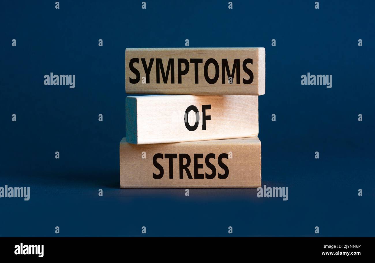Symptoms of stress symbol. Concept words Symptoms of stress on wooden ...