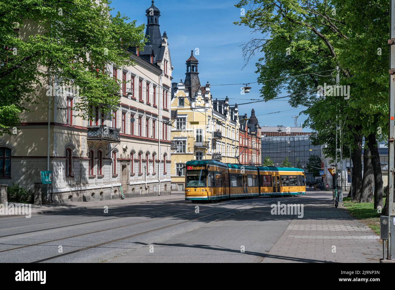 Tram on Hörngatan in the city center of Norrkoping, Sweden. The yellow ...