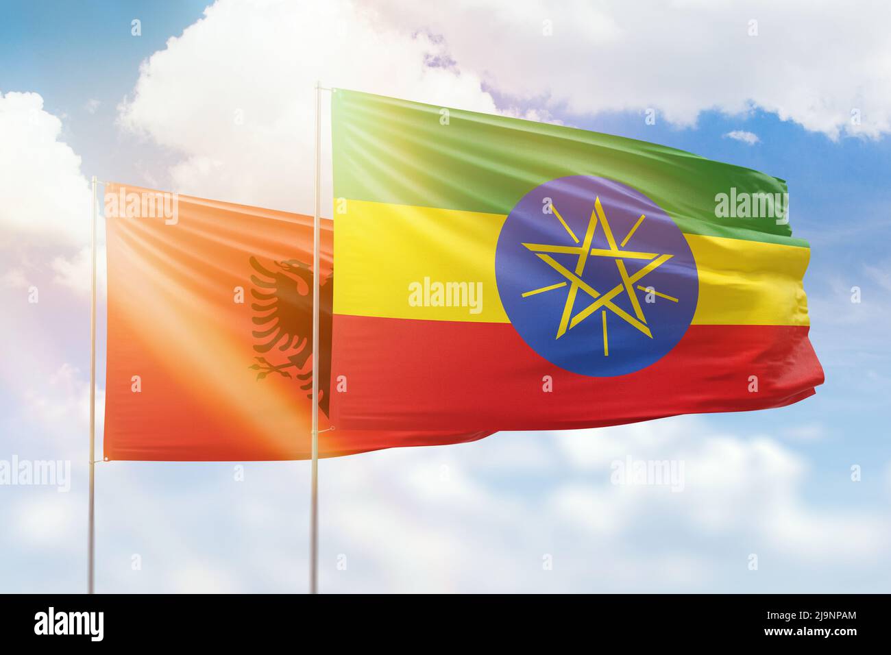 Sunny blue sky and flags of ethiopia and albania Stock Photo - Alamy