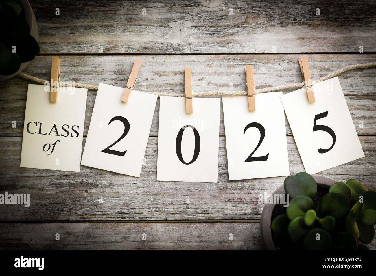 A set of printed cards spelling the word 2025 on an aged wooden ...
