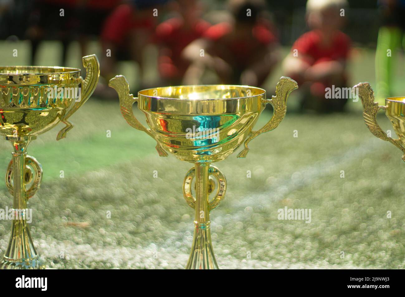 Gold Cups. Sports awards at competition. Details of football match ...