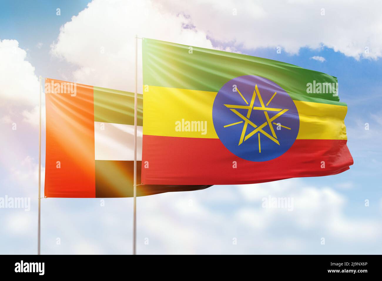 Sunny blue sky and flags of ethiopia and uae Stock Photo - Alamy