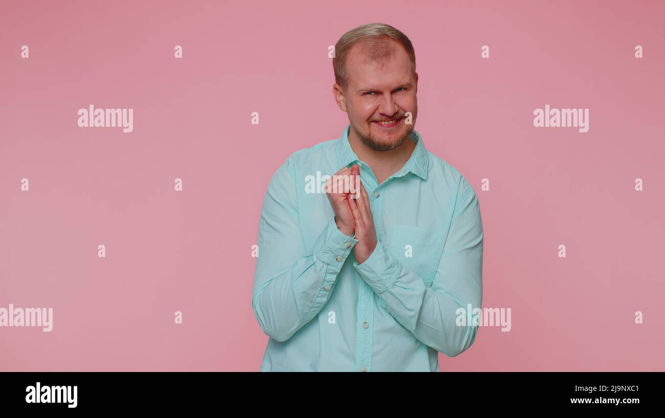 Sneaky cunning man with tricky face scheming evil plan, thinking over ...