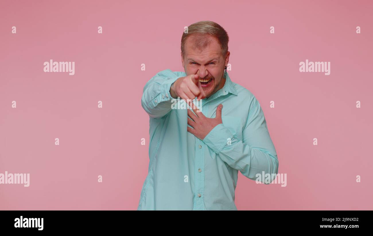 Man pointing finger to camera, laughing out loud, making fun of ...