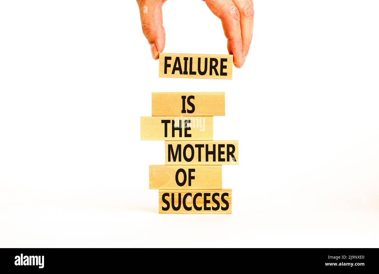 Failure or success symbol. Wooden blocks with words A failure is the ...