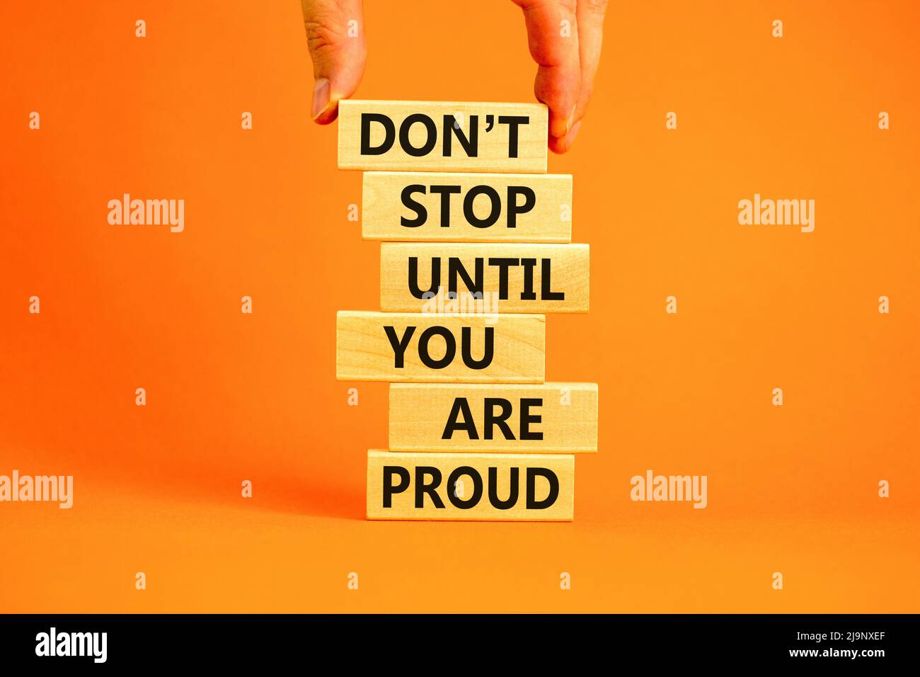 Motivation and inspiration symbol. Wood blocks with words Do not stop ...