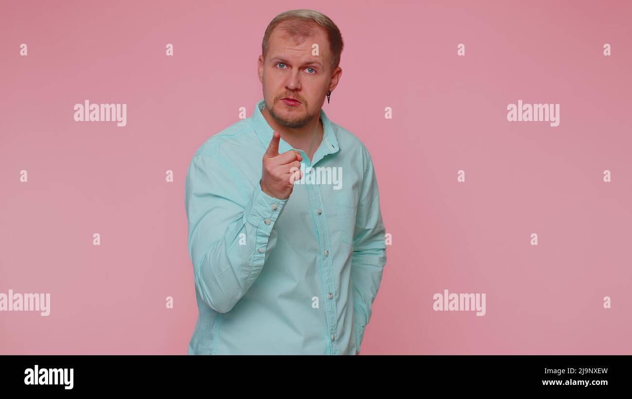 Displeased man gesturing hands with irritation, displeasure, blaming ...