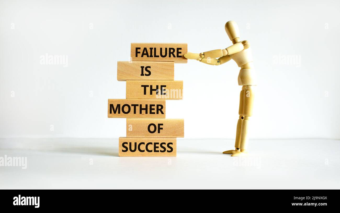 Failure or success symbol. Wooden blocks with words A failure is the ...