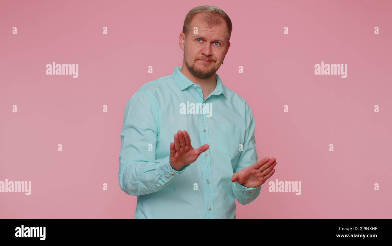 Man warning with admonishing finger gesture, saying no, be careful ...