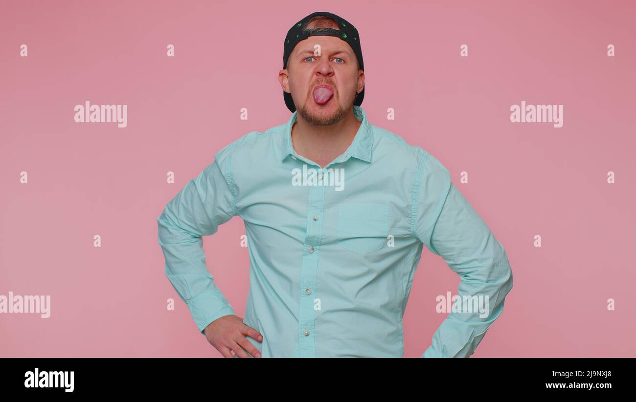 Funny man showing tongue making faces at camera, fooling around, joking ...
