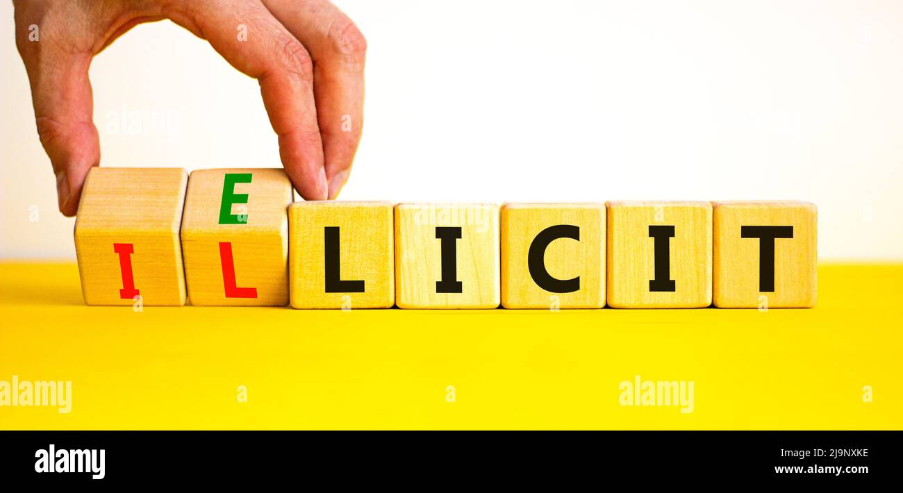Illicit or elicit symbol. Businessman turns wooden cubes and changes ...