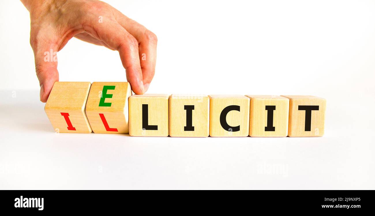 Illicit or elicit symbol. Businessman turns wooden cubes and changes ...