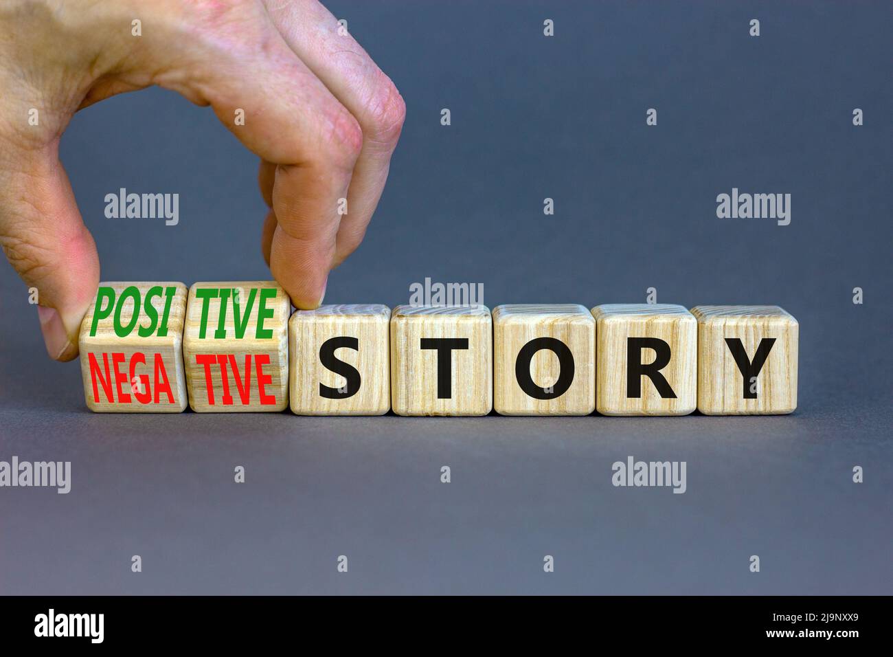 Positive or negative story symbol. Businessman turns cubes, changes ...