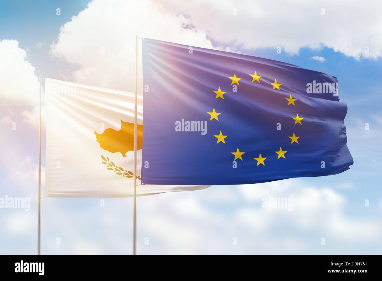 Sunny blue sky and flags of european union and cyprus Stock Photo - Alamy