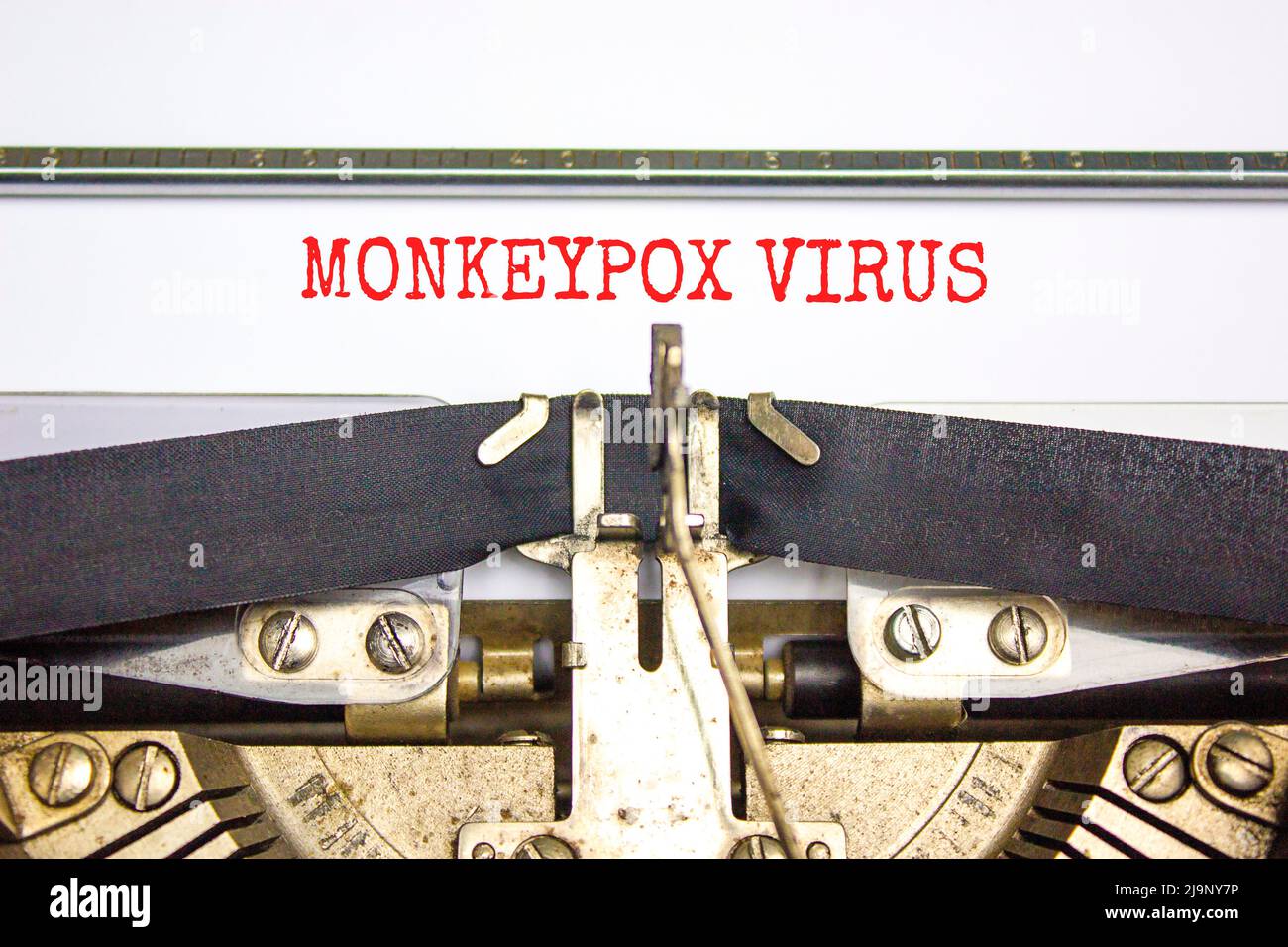 Monkeypox virus symbol. Concept words Monkeypox virus typed on retro ...