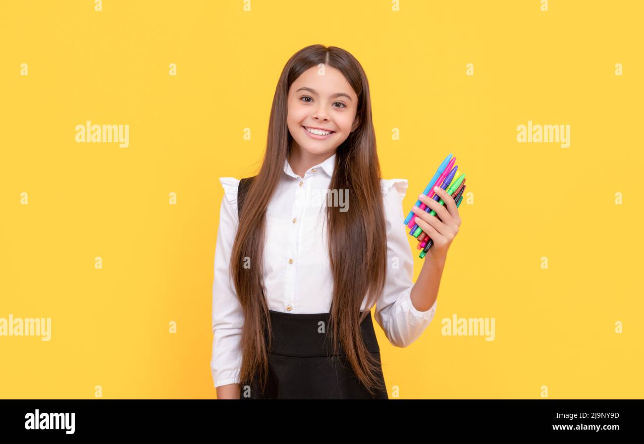 Fun and creativity simultaneously. Happy child hold felt-tip pens ...