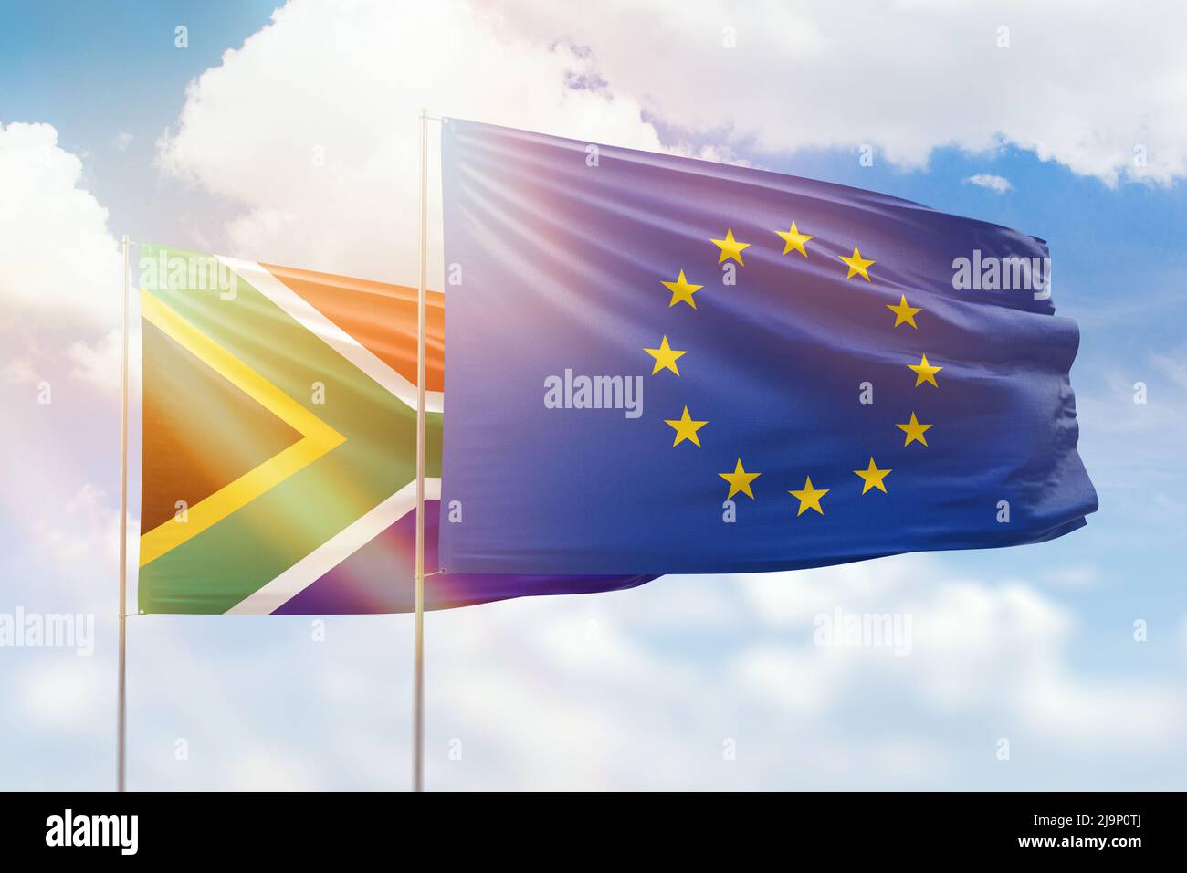 Sunny blue sky and flags of european union and south africa Stock Photo ...