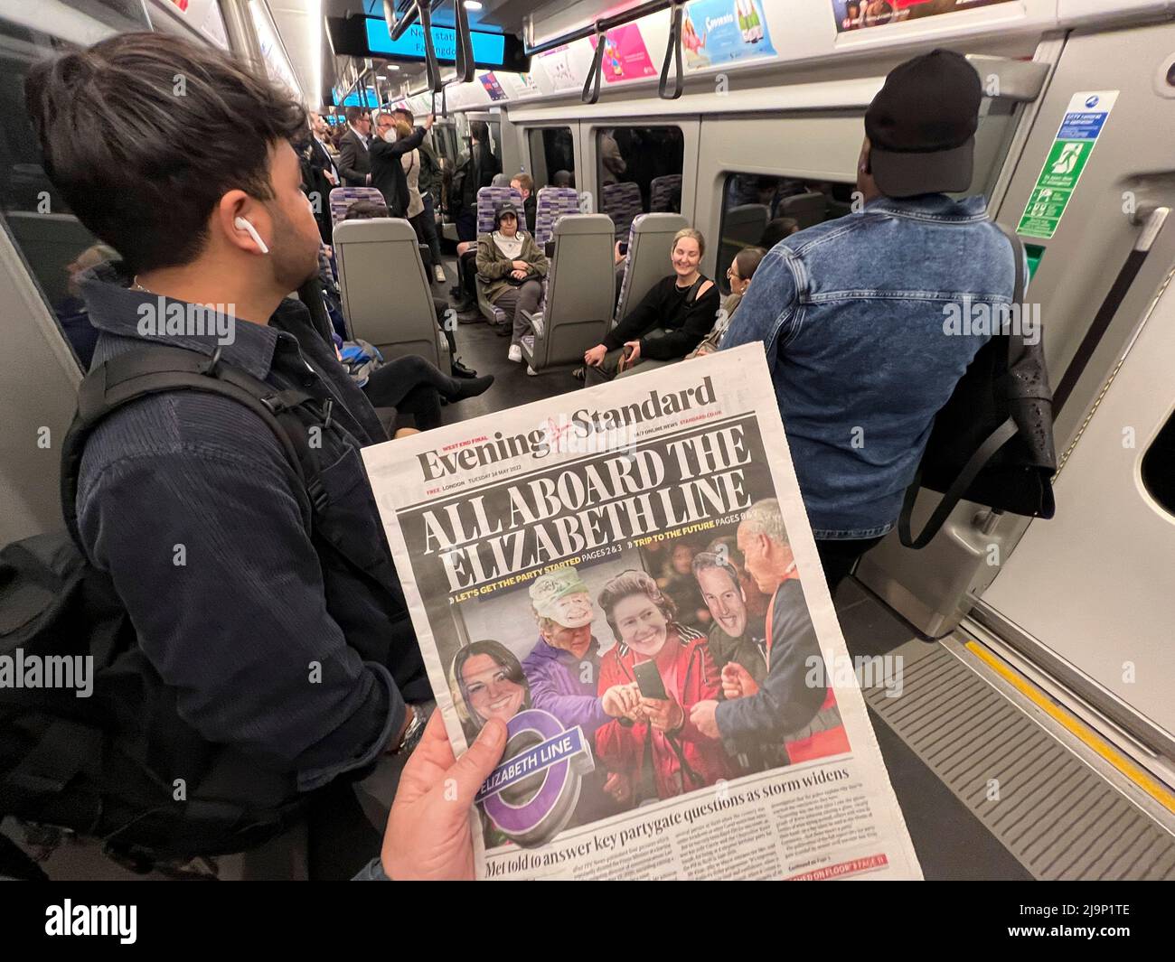 Passengers travel along with the Elizabeth Line in London, as the new ...
