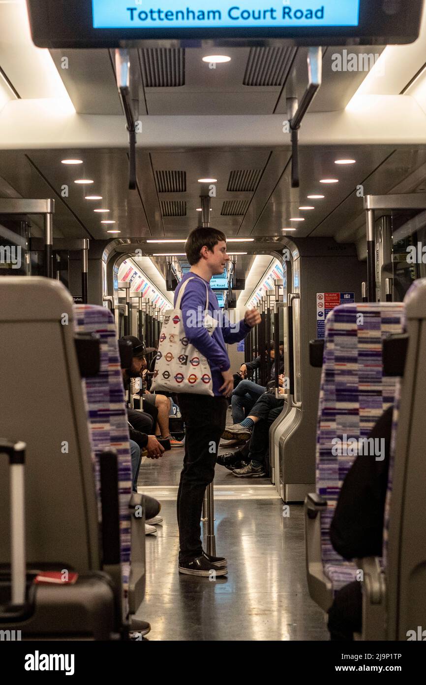 Passengers travel along with the Elizabeth Line in London, as the new ...