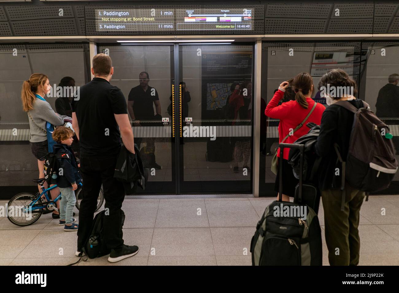 Passengers travel along with the Elizabeth Line in London, as the new ...