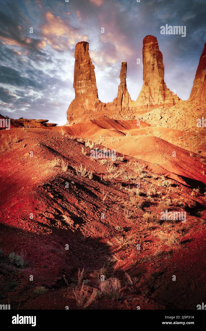 The three sisters rise into the desert sky in Monument Valley, Arizona ...