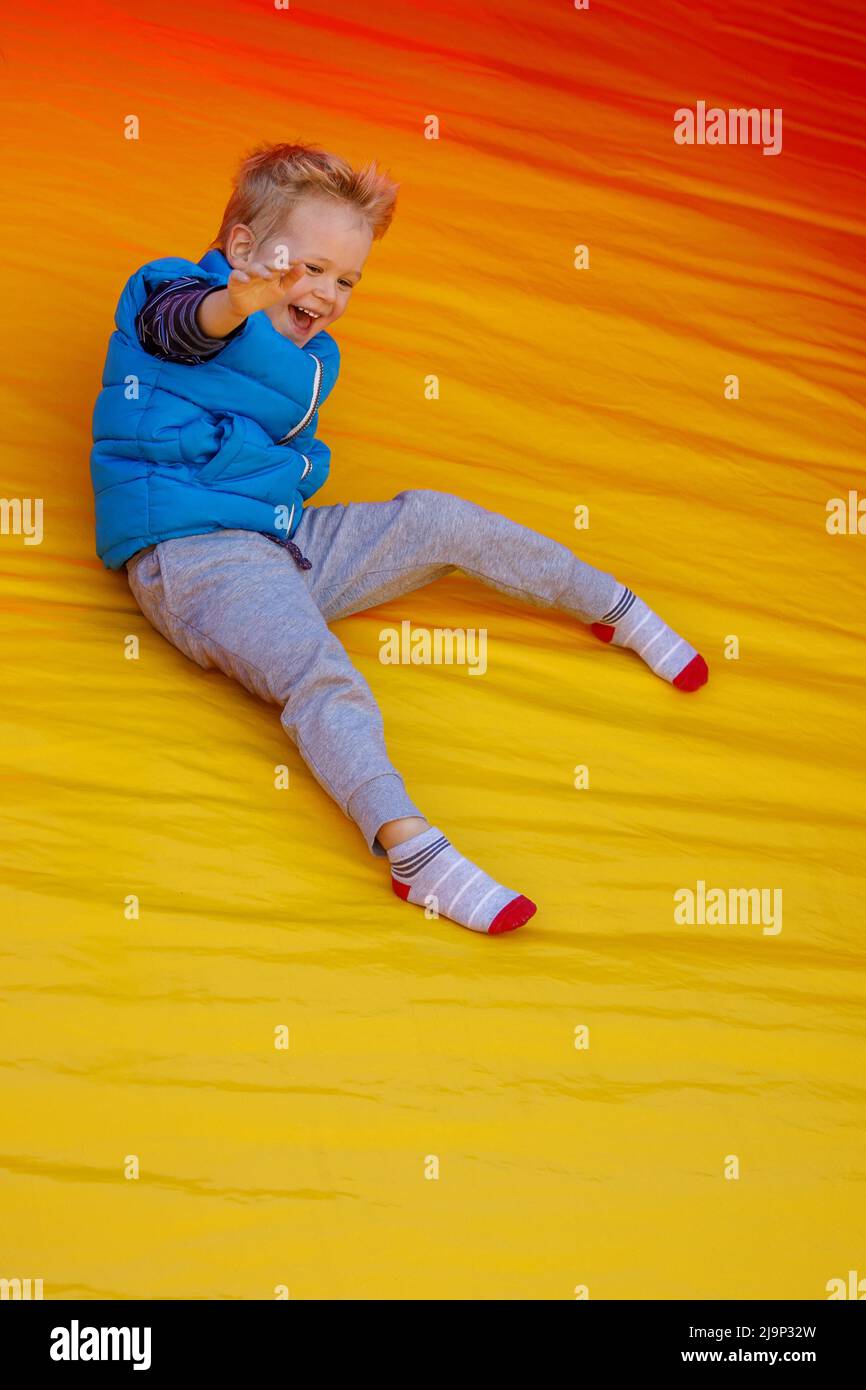 Boy slide hi-res stock photography and images - Alamy