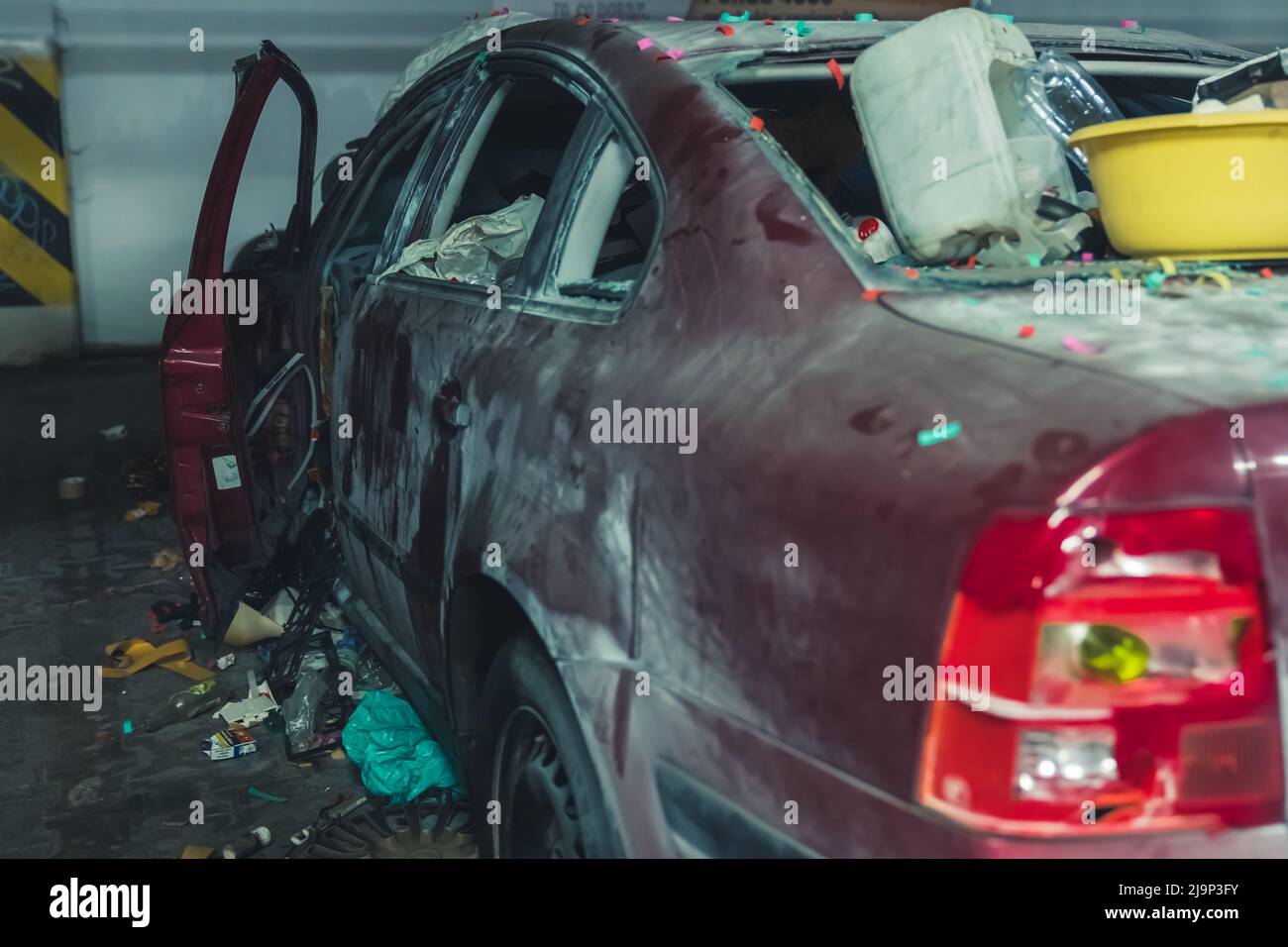 destroyed car in the underground parking lot. High quality photo Stock ...