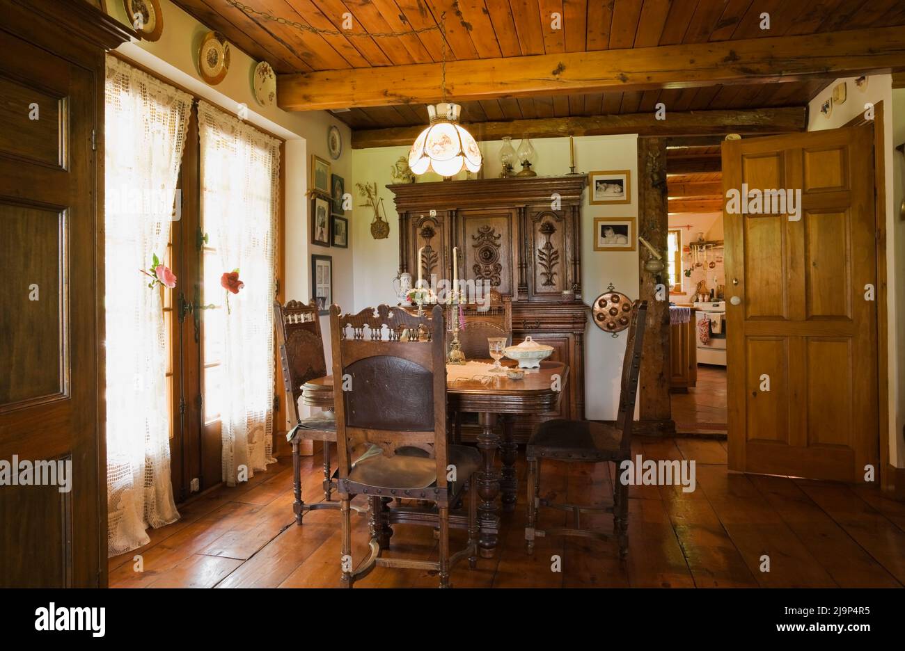 Antique table, high back chairs and buffet in dining room inside old ...