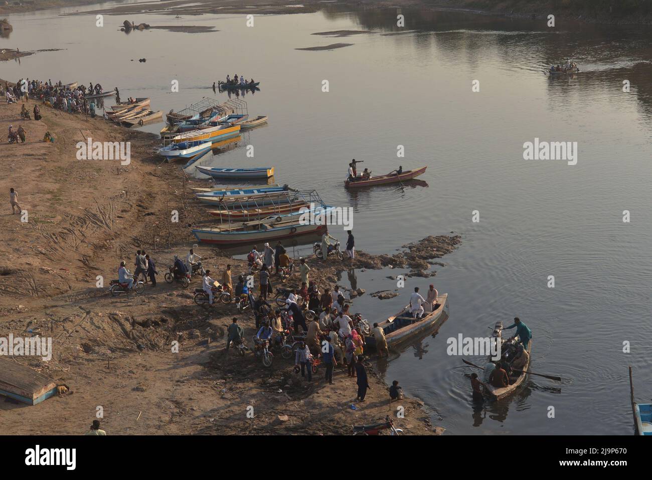 May 24, 2022, Lahore, Punjab, Pakistan: Pakistani commuters try to make ...