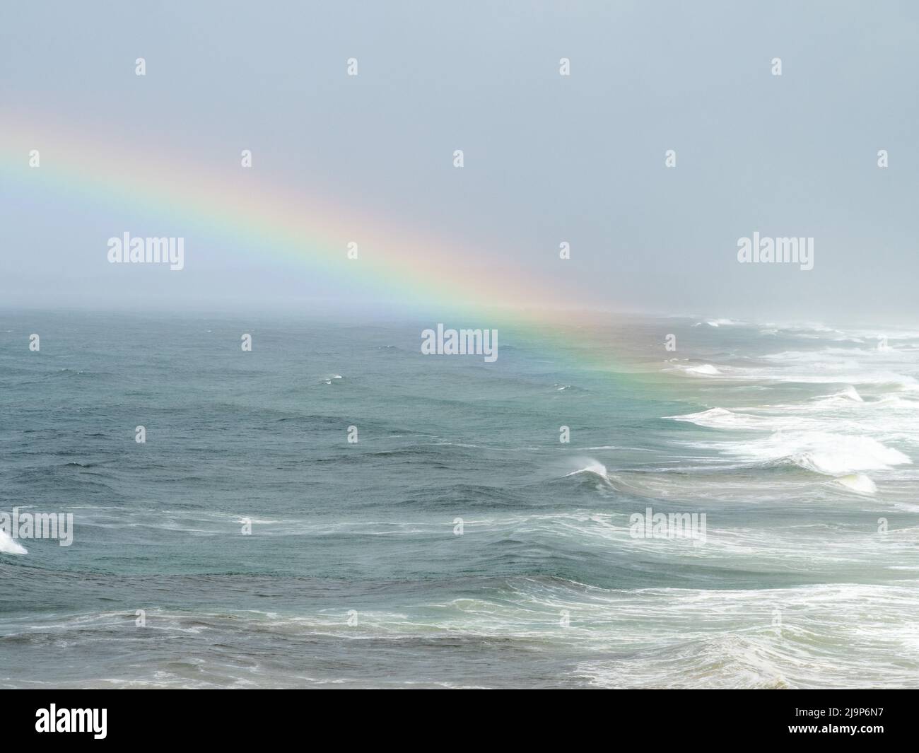 A rainbow of all the colours over the sea, waves breaking, love nature ...