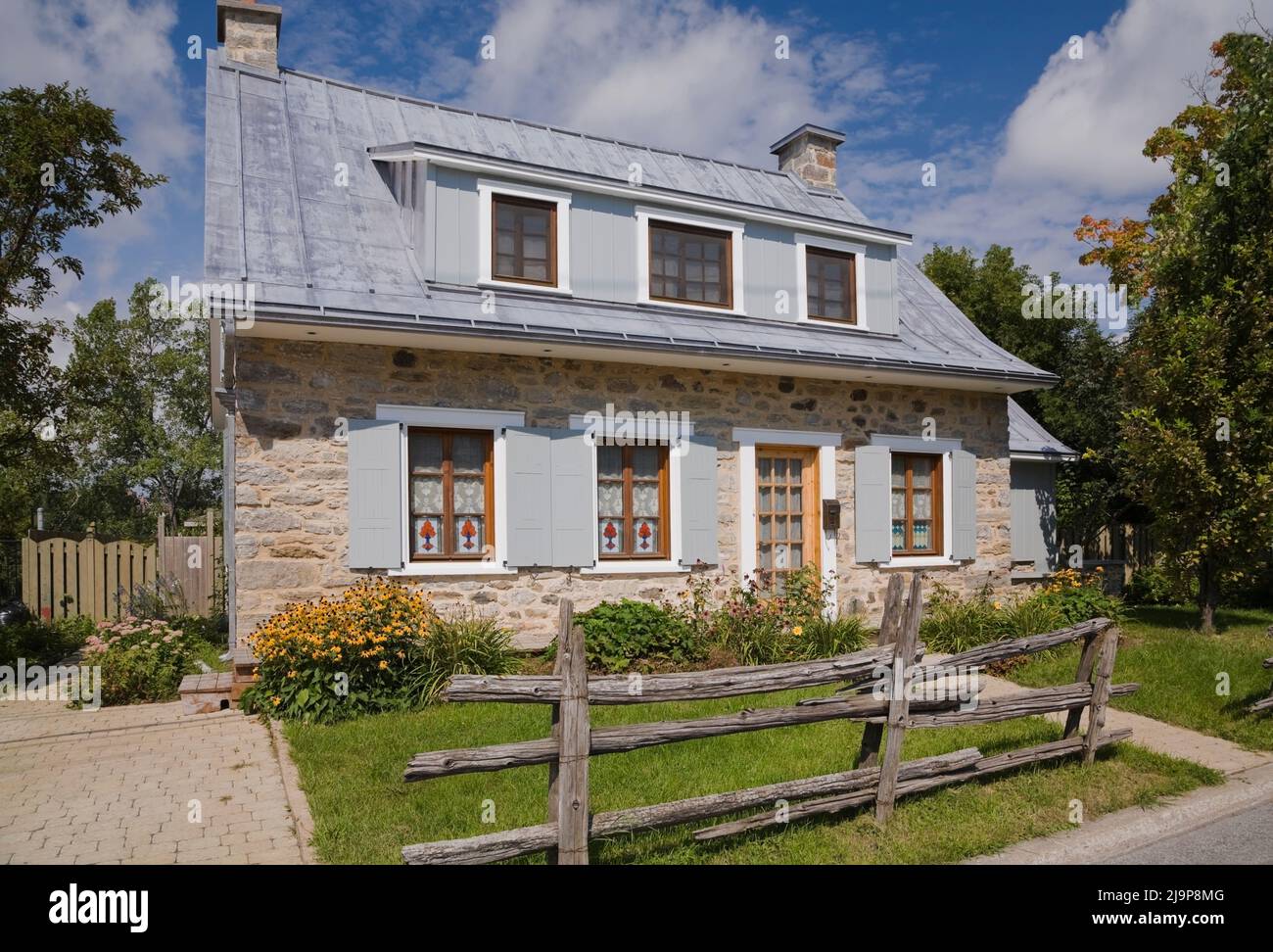 Old circa 1825 Canadiana cottage style fieldstone home with grey sheet ...