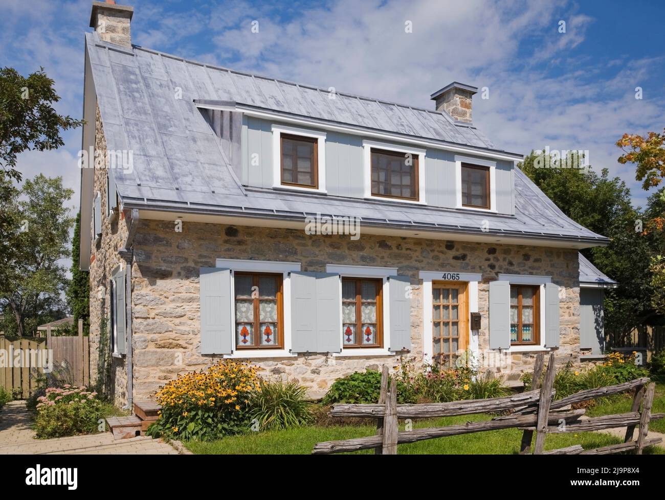 Old circa 1825 Canadiana cottage style fieldstone home with grey sheet ...