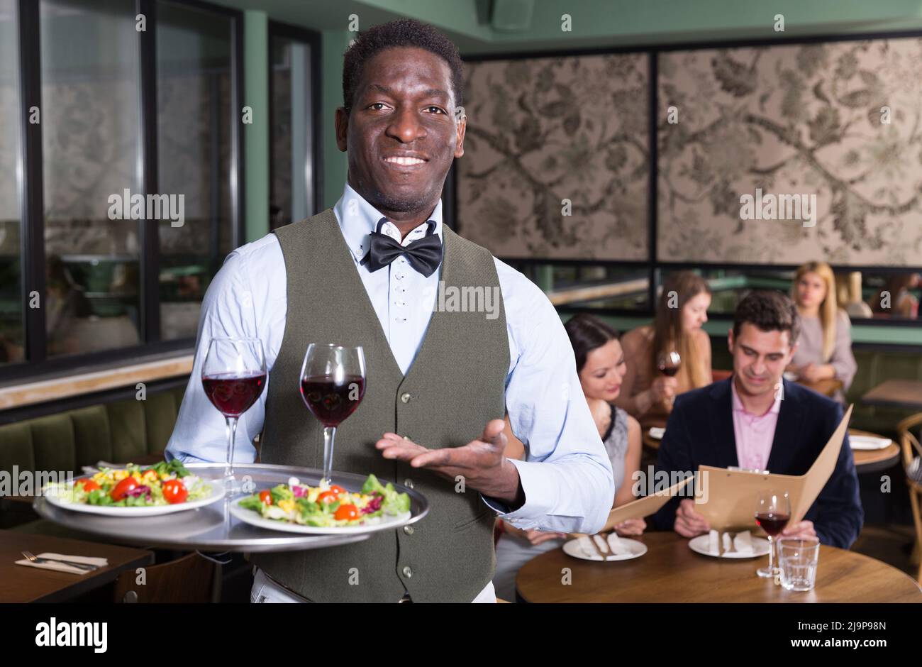 African American waiter with serving tray Stock Photo - Alamy