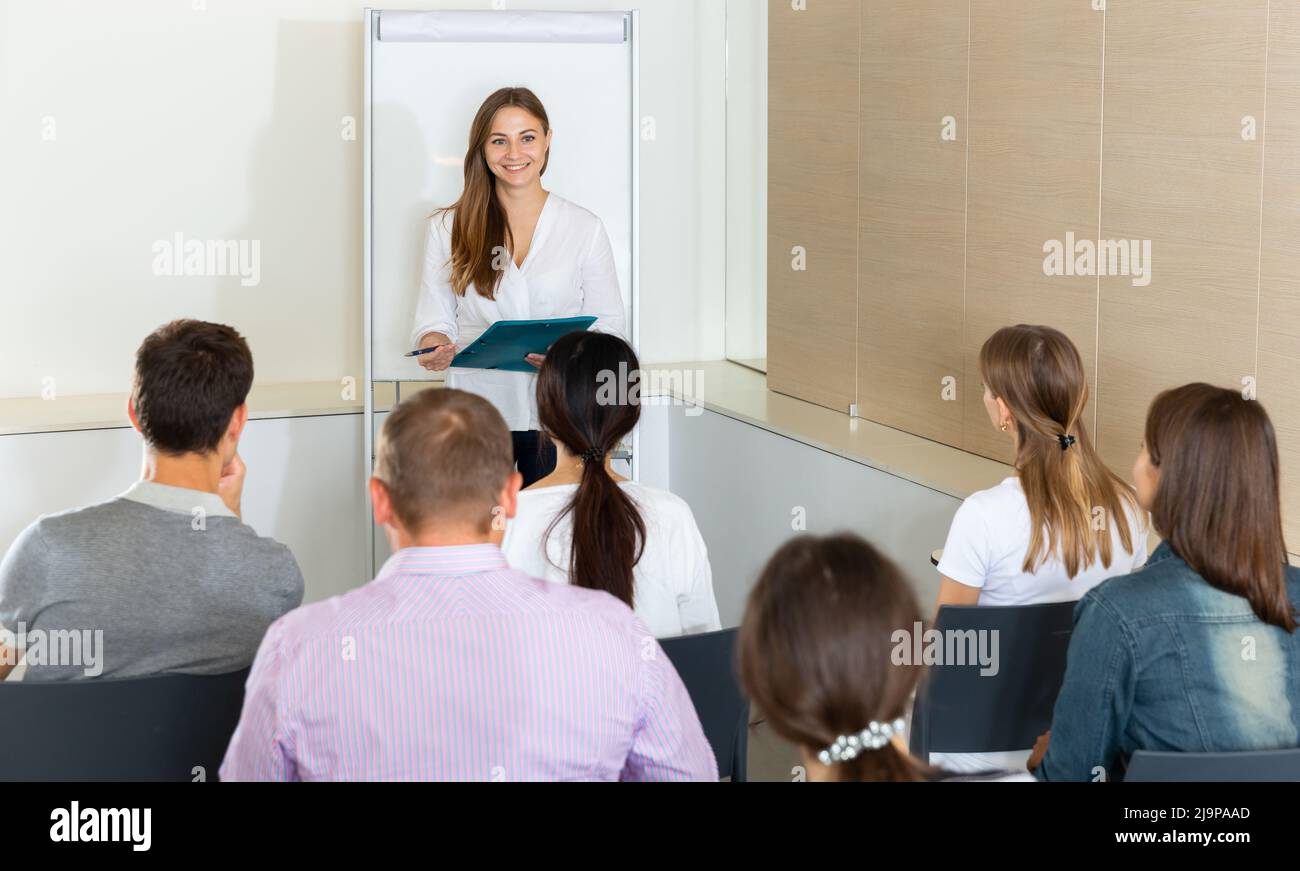 Female business coach communicating with auditorium Stock Photo - Alamy