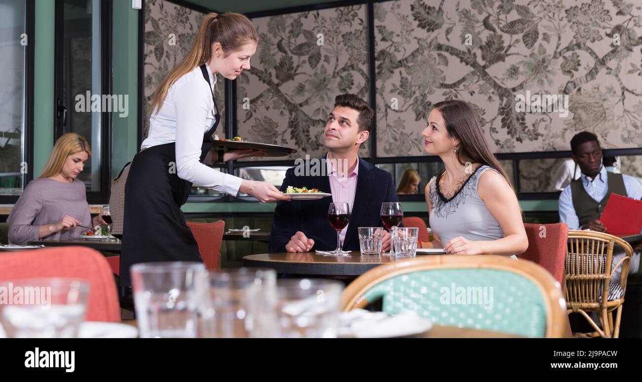 Portrait waitress serving customer hi-res stock photography and images ...